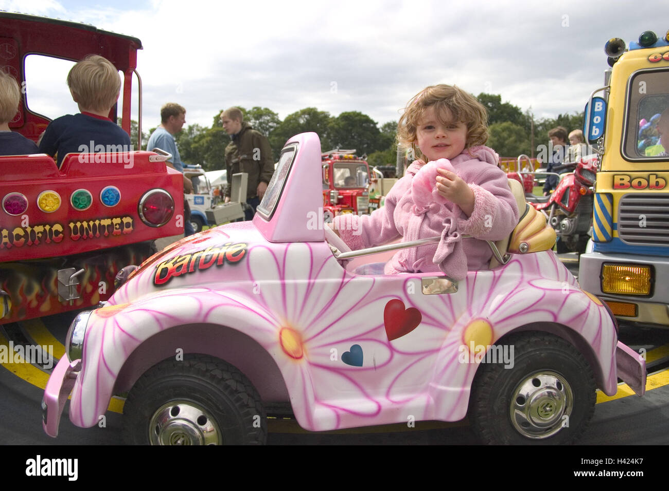 Roundabout, car, girl, smile, eat candy floss, fair, public festival ...