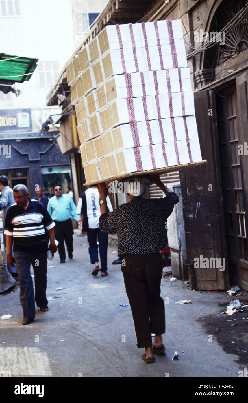 Woman Carrying Heavy Load