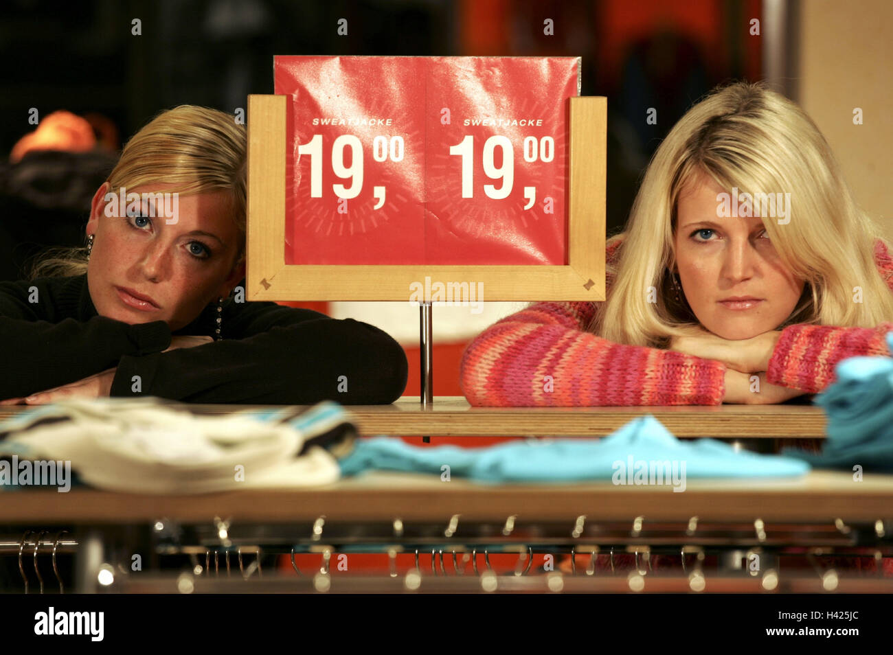 Women, two, young, blond, Shopping, Clothing, price marks, serious ...