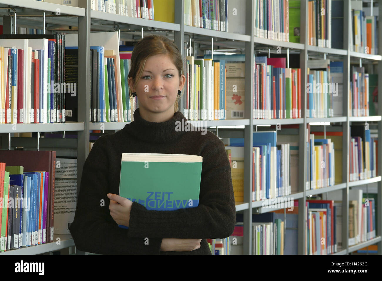 Library, bookshelves, woman, young, stand, hold book, portrait, library ...