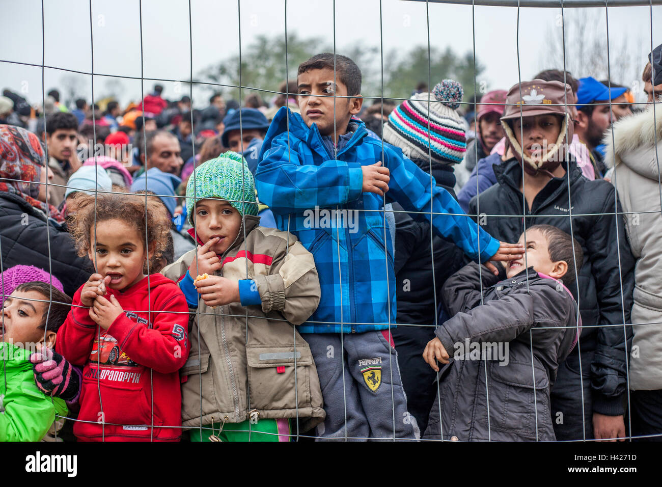 Children behind the fence waiting to cross the Slovenian-Austrian ...