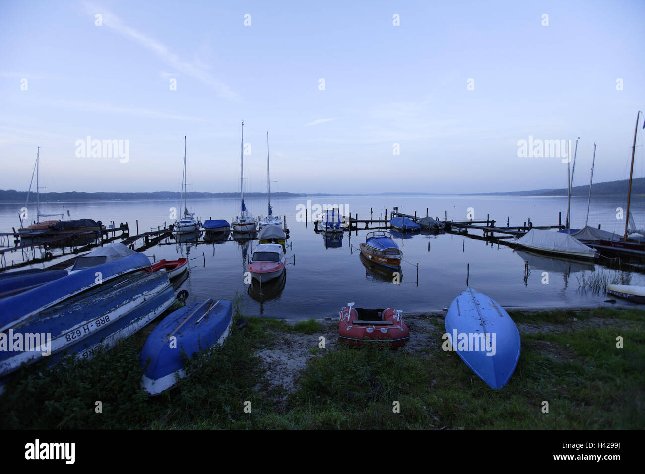 Lakeside, boats, dusk Stock Photo - Alamy