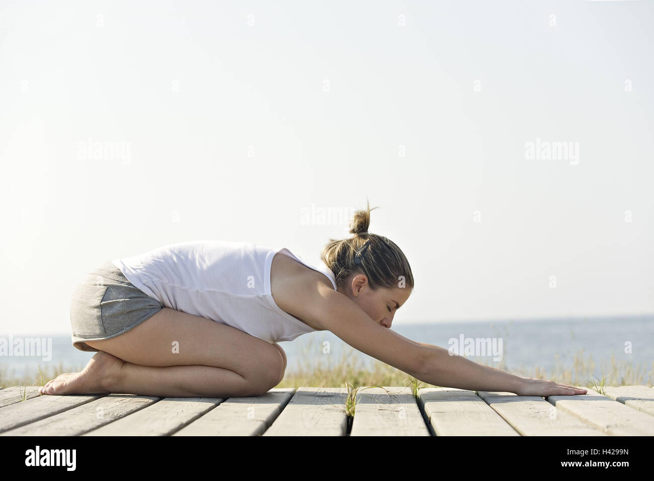 Woman, sport, gymnastics, beach, sea Stock Photo - Alamy