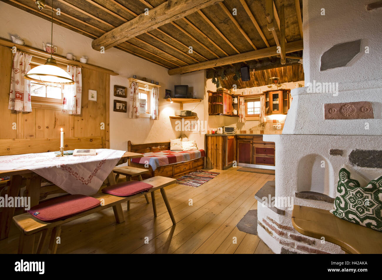 Austria, Carinthia, wooden hut, inside, table, chimney Stock Photo - Alamy