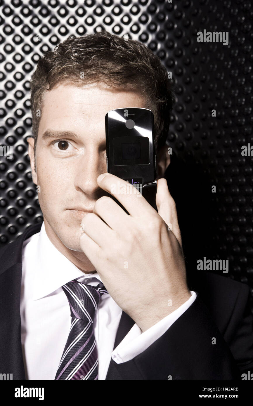 Businessman, mobile phone, eye, reproach, portrait, model released ...