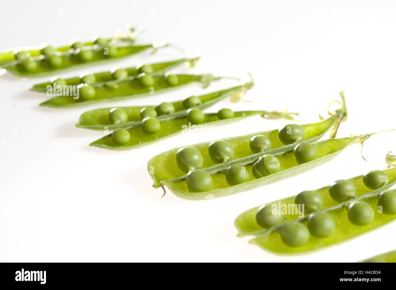 Pea pods, halves Stock Photo - Alamy
