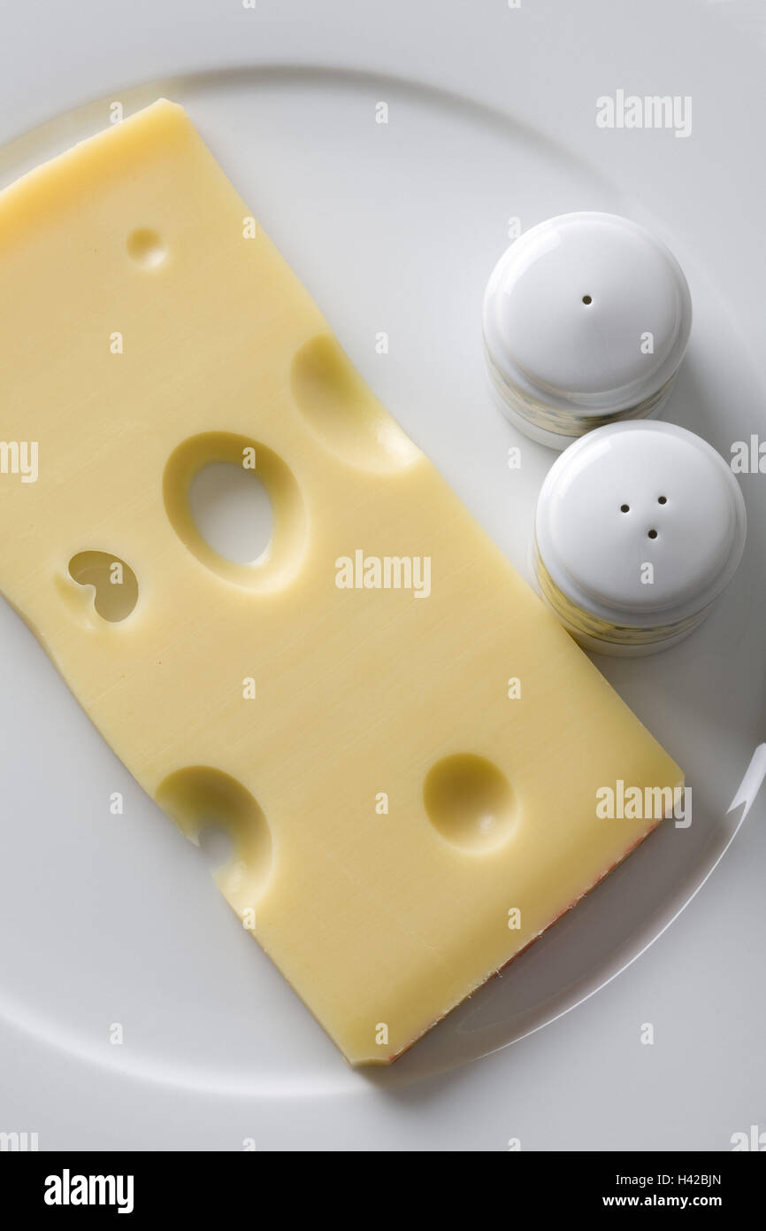 Cheese piece, salt-cellar, pepperpot Stock Photo - Alamy