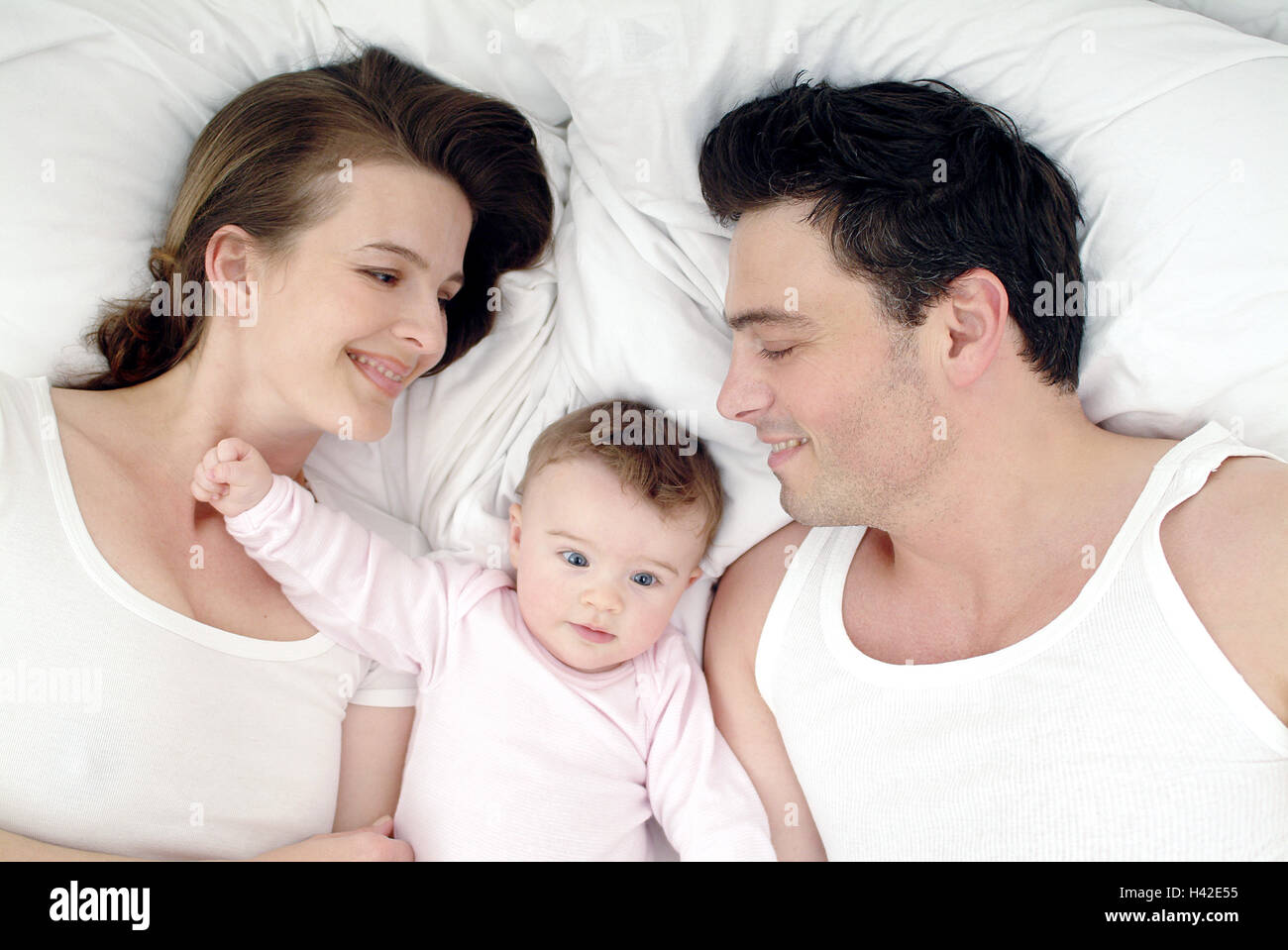 Bed, parents, baby, cuddles, detail Family, child, 7 months, mutuality ...