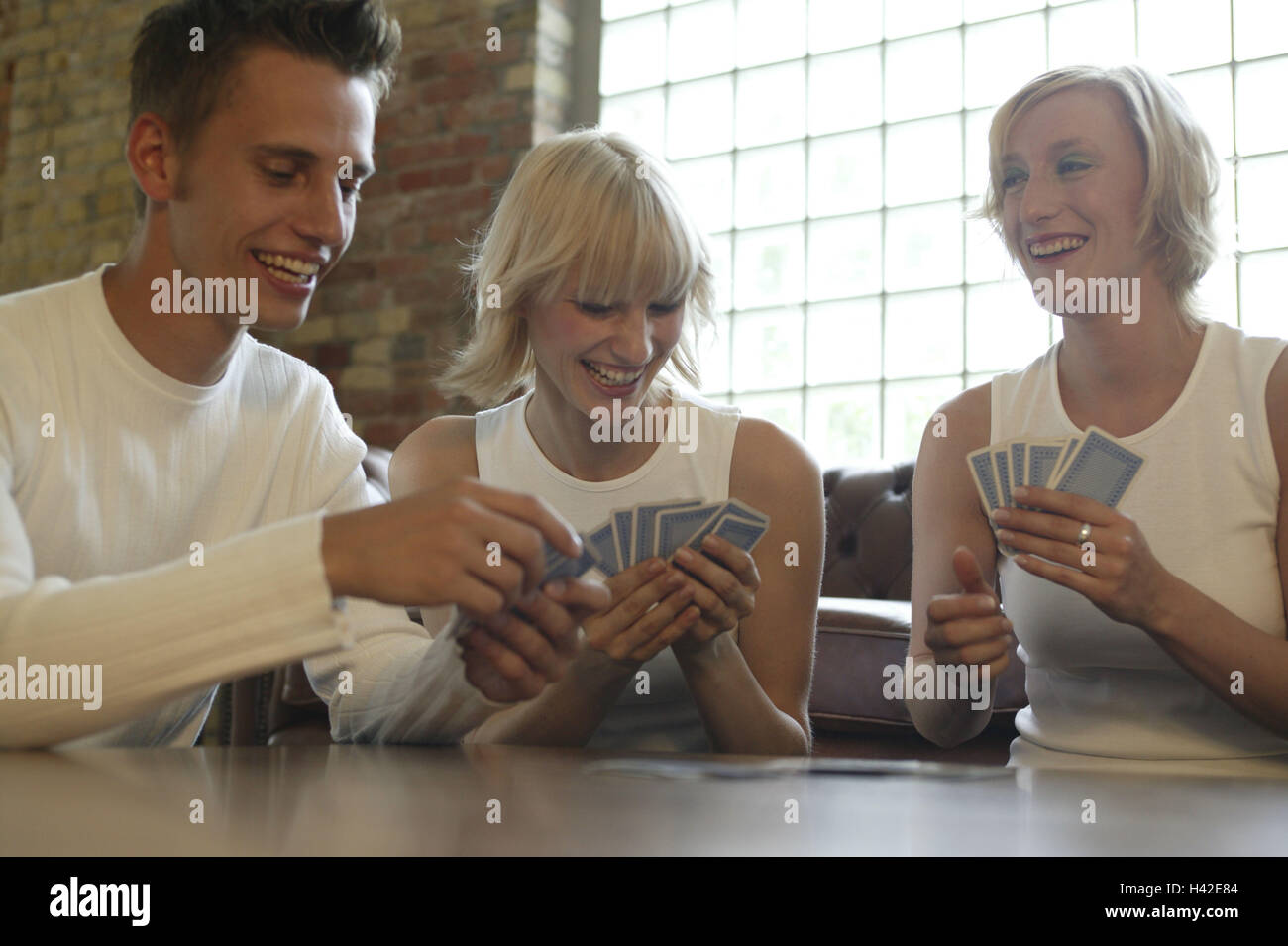 Loft, women, man, young, happy, card game, at home, couple, friendship ...