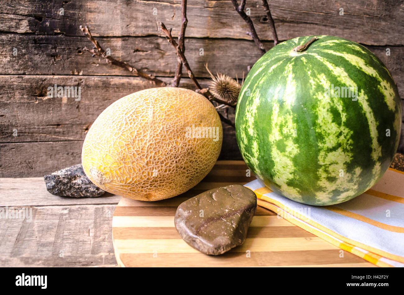 Ripe melon and watermelon with kitchen towel Stock Photo - Alamy