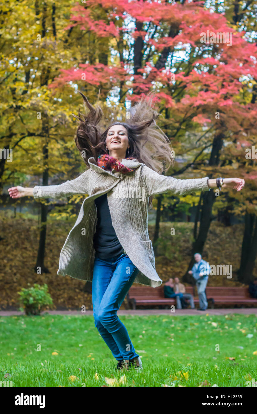 happy girl jumping on grass Stock Photo - Alamy