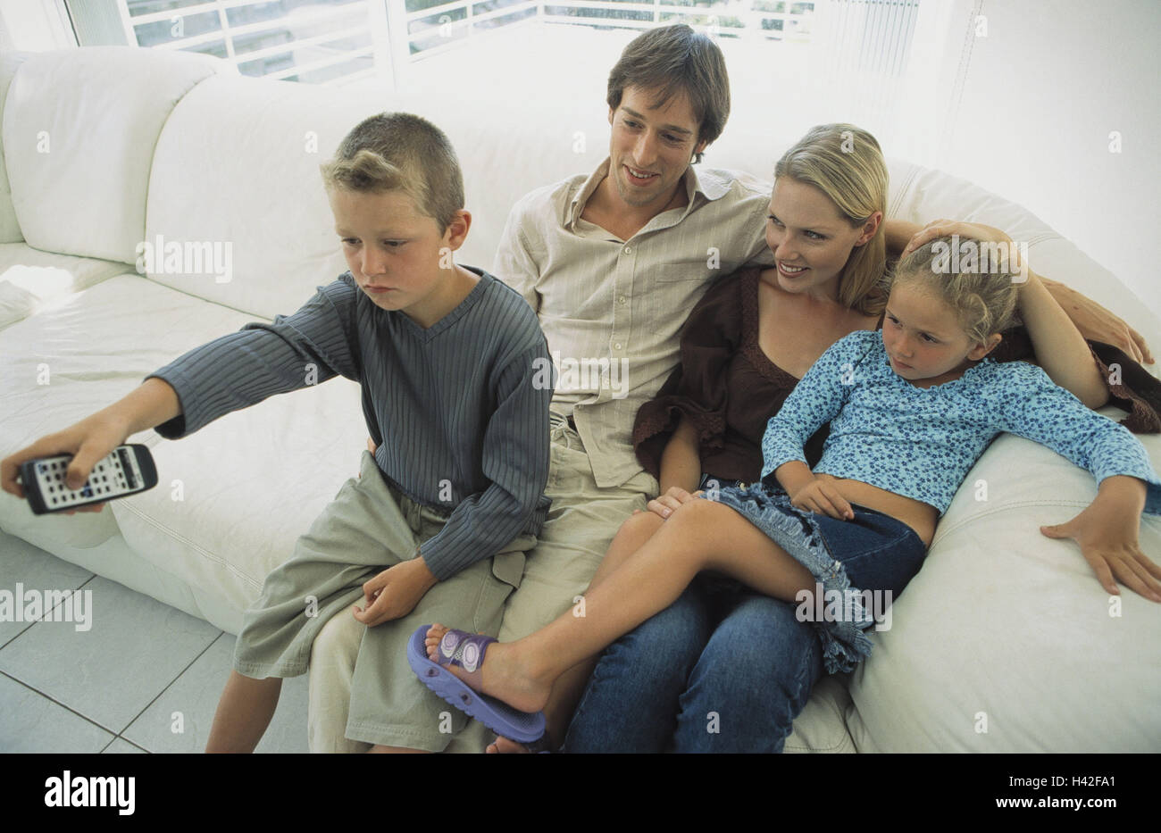 Sofa, family, television, boy, remote control, gesture, parents ...