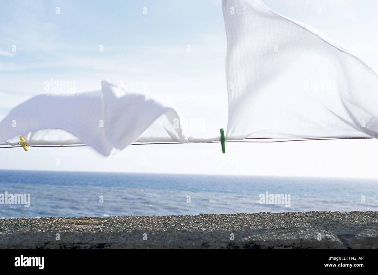 Clothes line, cloths, wind, blowing, sea gaze Stock Photo - Alamy