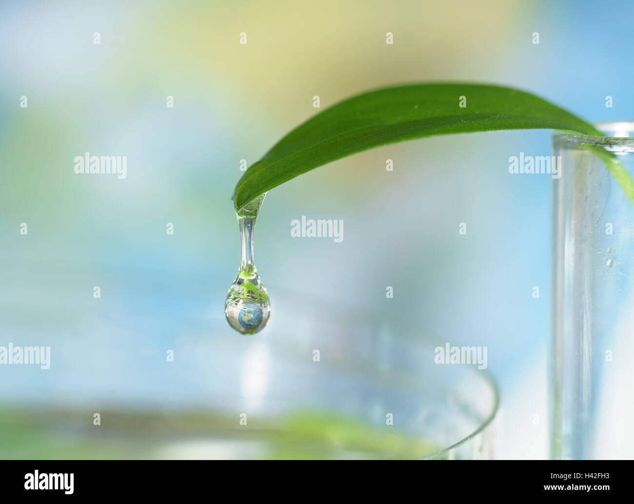 Closeup of water drop with earth sphere reflection Stock Photo - Alamy