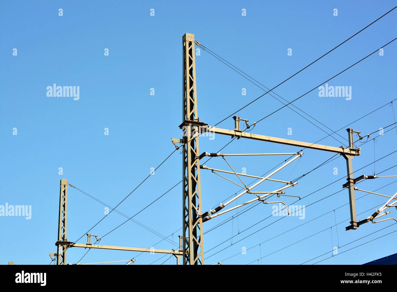 Industrial high voltage power cables against blue sky Stock Photo - Alamy