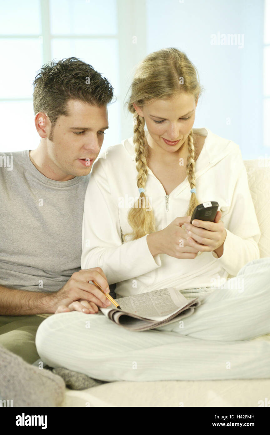 Couple, young, newspaper, advertisement, selection, phone, call, detail ...