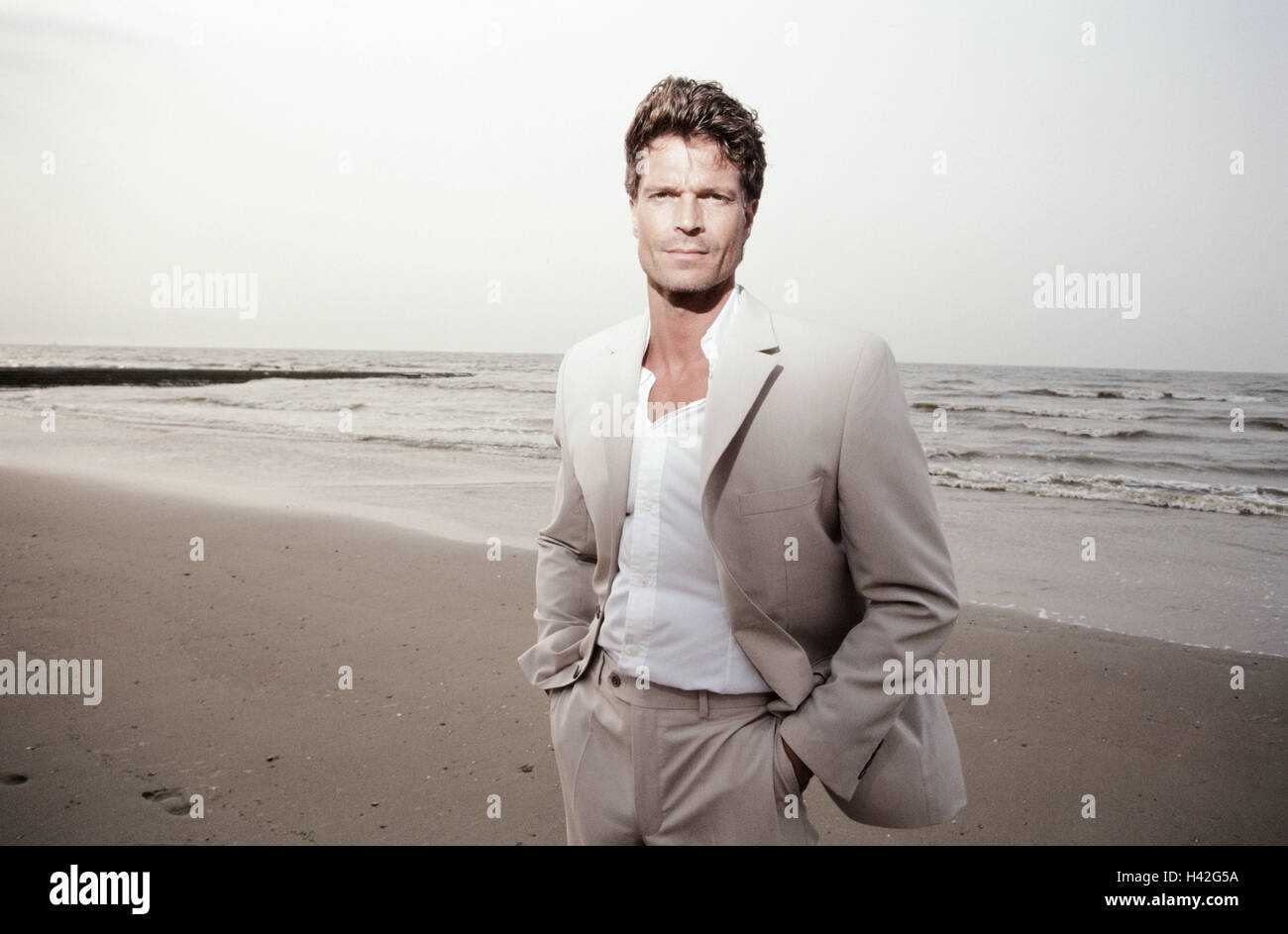 Sandy beach, businessman, nonchalant, Half portrait, twilight, Beach ...