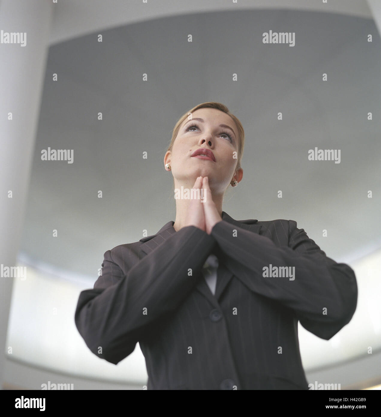 Folded hands stand High Resolution Stock Photography and Images - Alamy