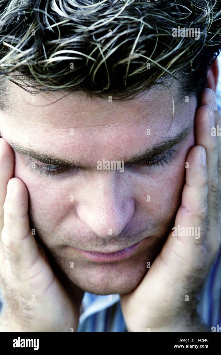 Man, lowered gaze, sad, depressive, portrait 24 years, 20-30 years ...