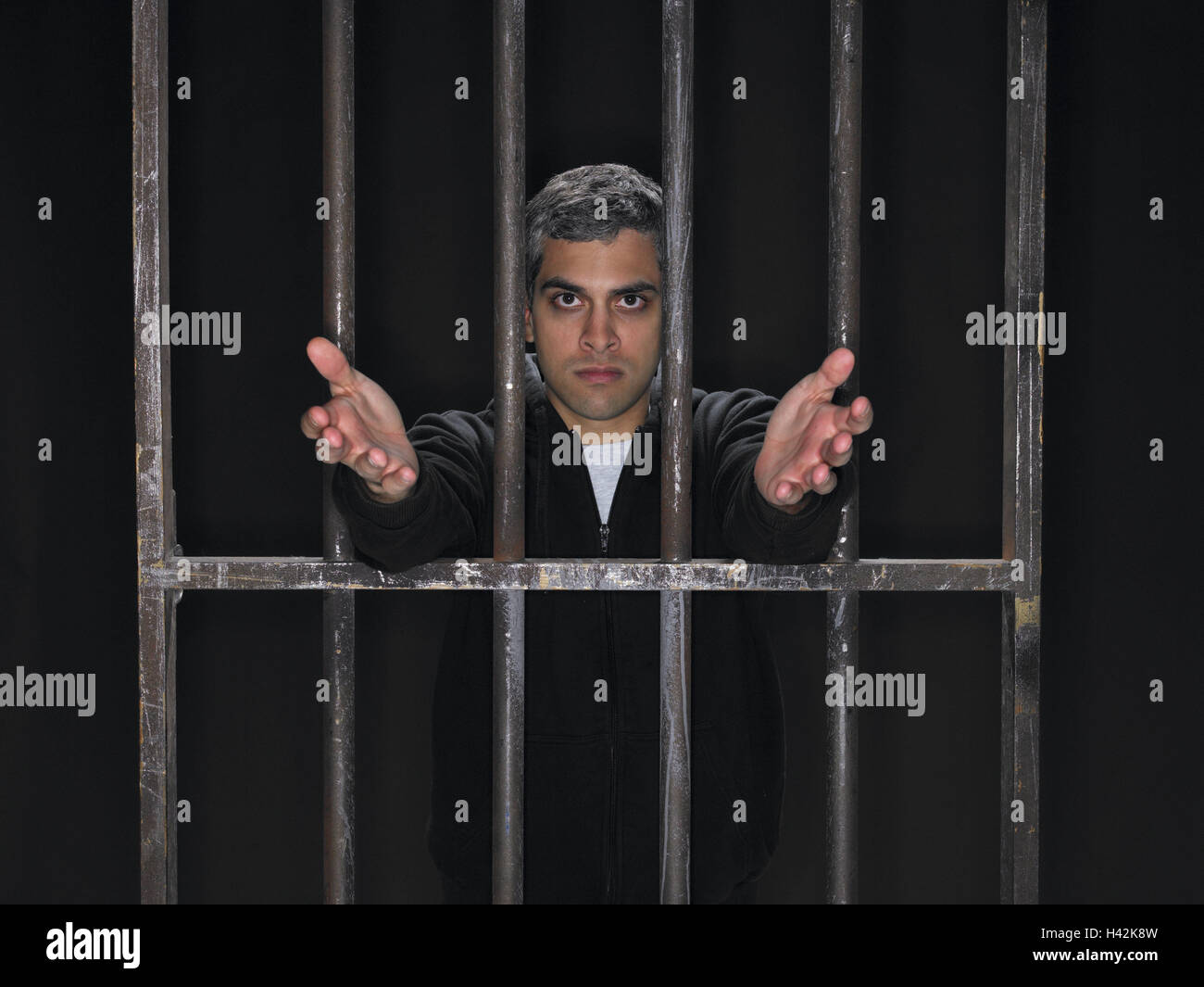 Man, prison, bars, hands stretch, hope, help-searching, grid, cell ...
