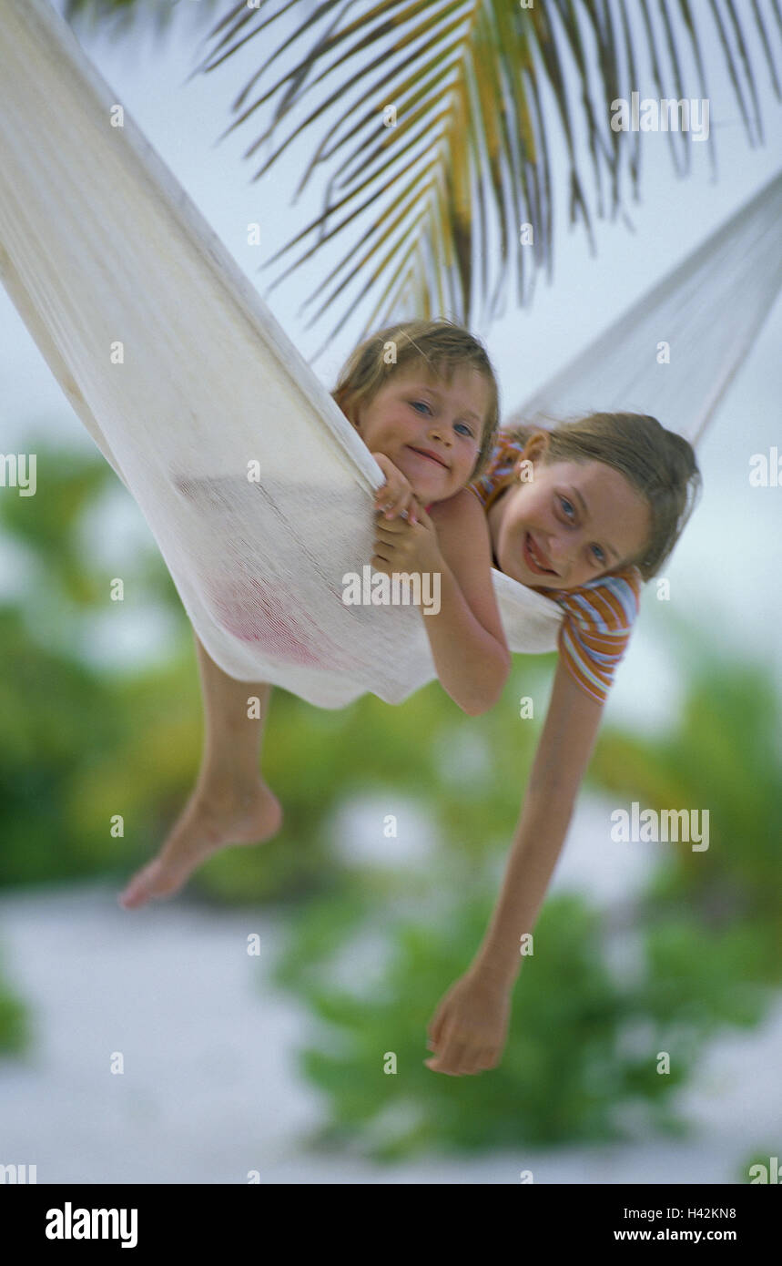 Palms, children, girls, hammock, smiling, portrait Stock Photo - Alamy