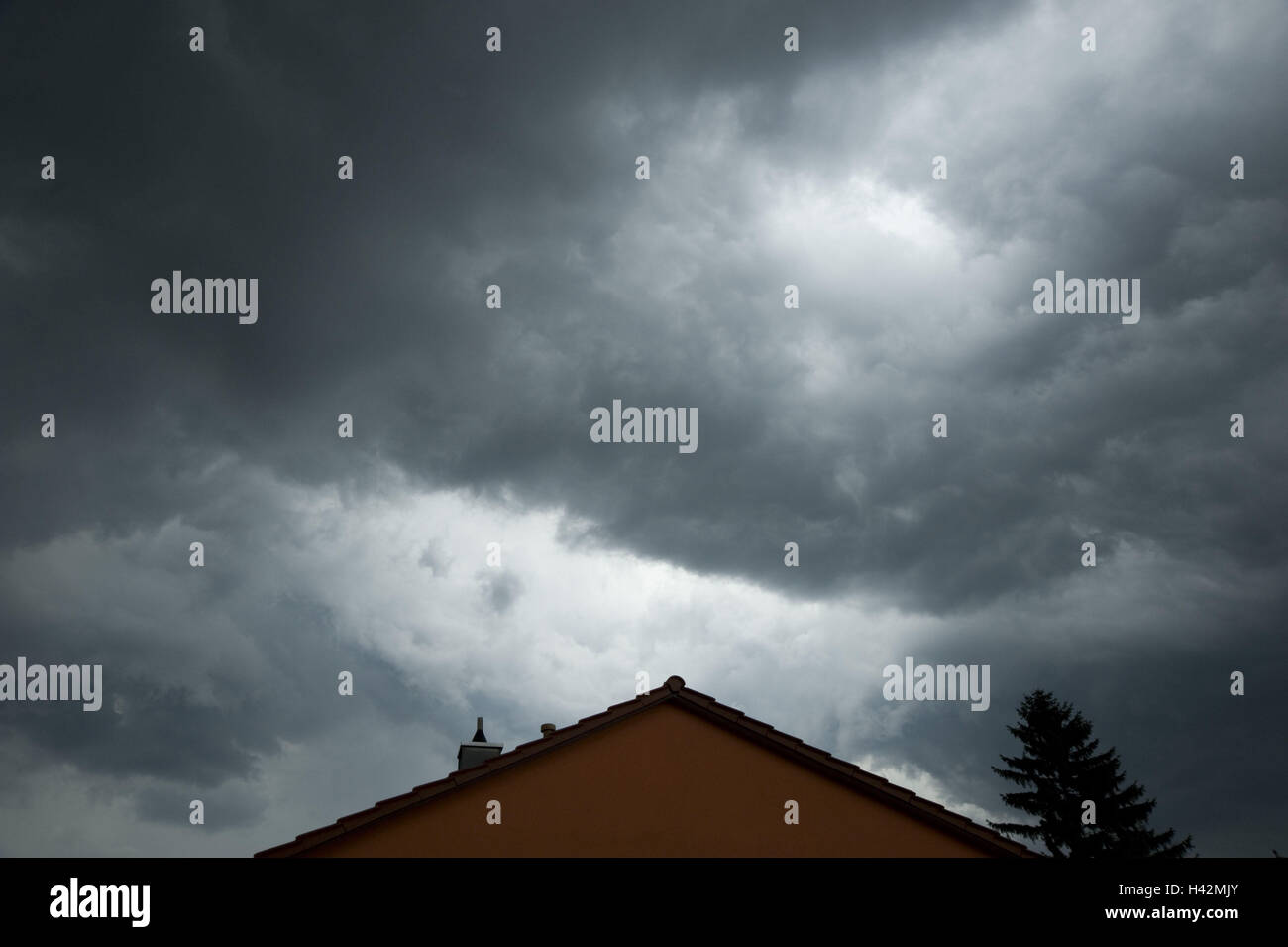 House facade, detail, rain clouds Stock Photo - Alamy
