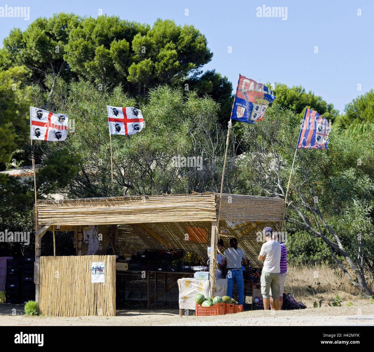 Italy, island Sardinia, southwest coast, roadside, sales booth, flags ...