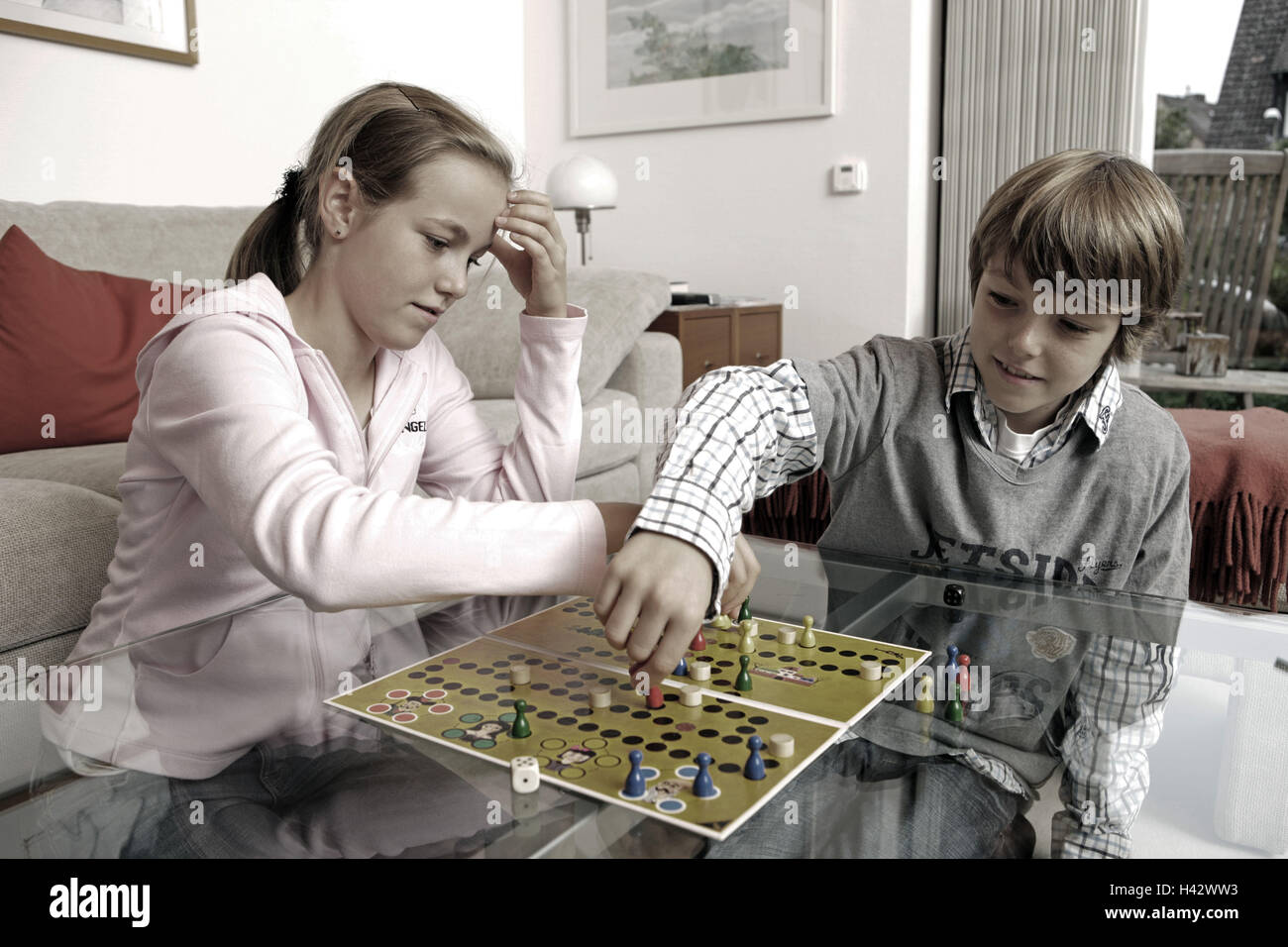 Children, board game, portrait Stock Photo - Alamy