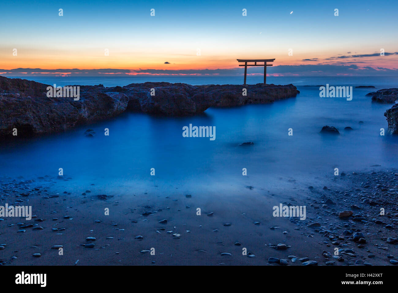 Toroii Japanese shrine gate sunrise at sea Oarai city , Ibaraki Japan ...
