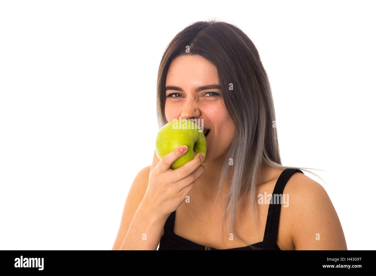 Woman eating green apple Stock Photo - Alamy