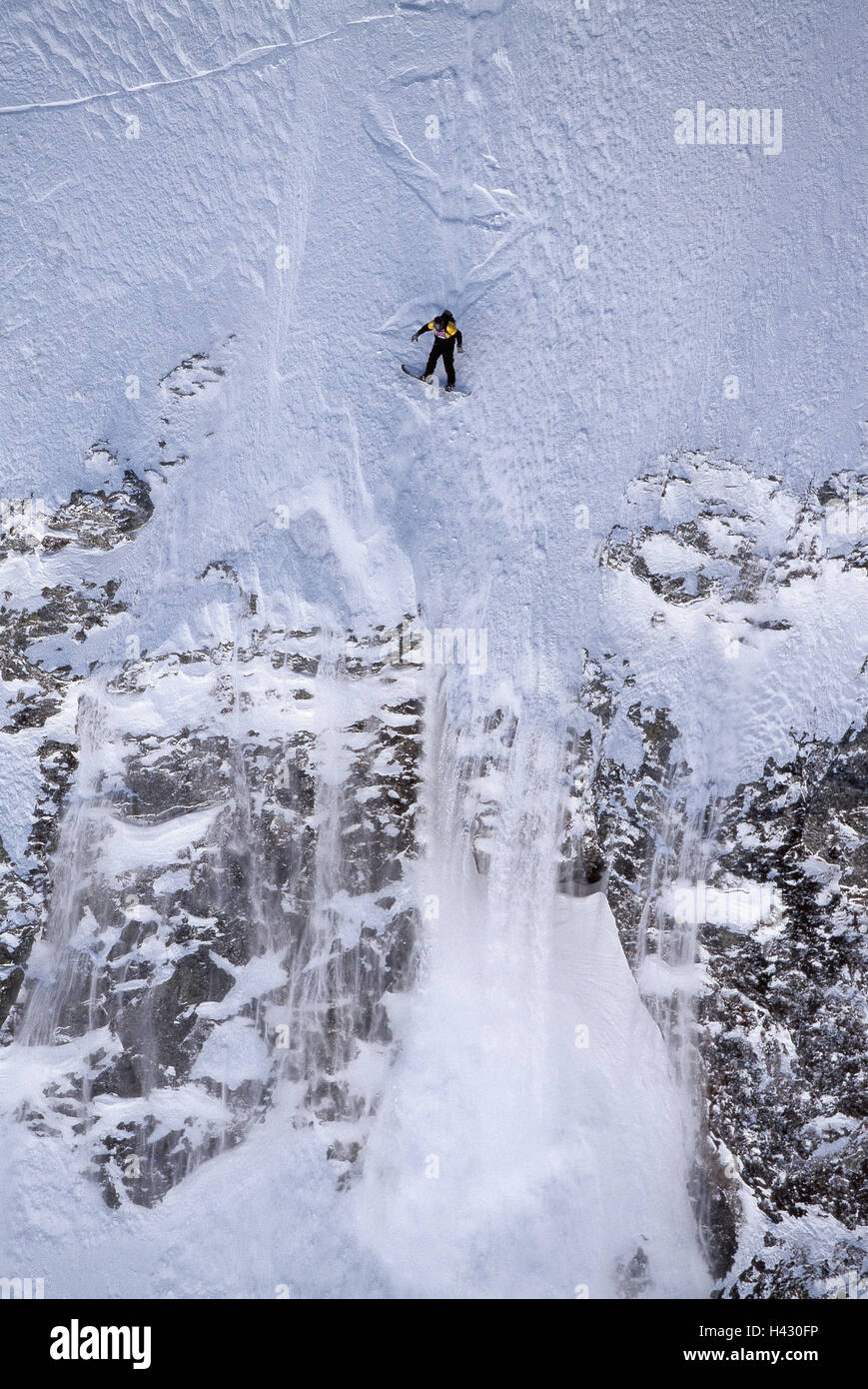Mountains, rocks, snowboarders, concentration, no model release, cliff ...