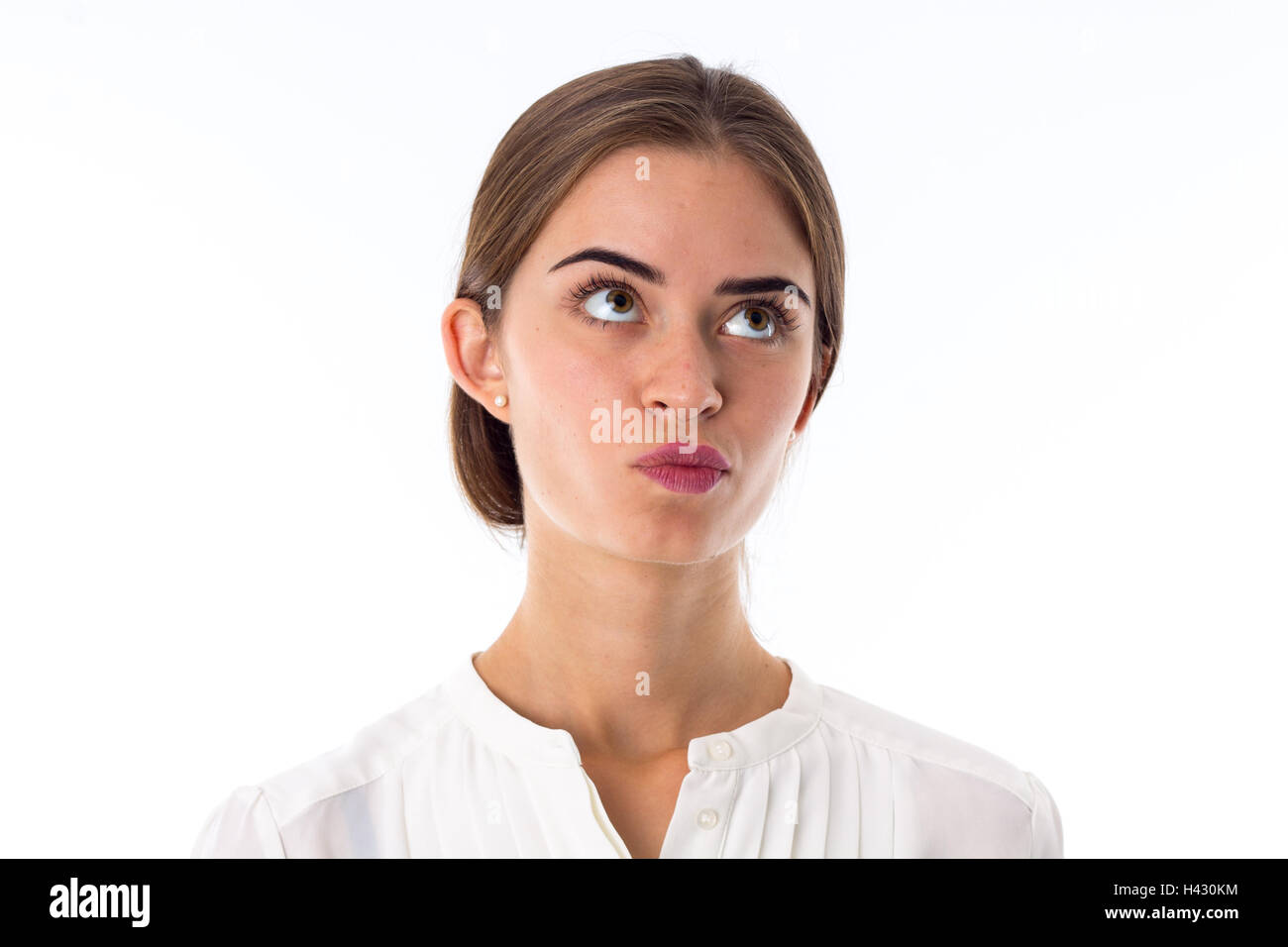 Woman thinking something over Stock Photo - Alamy