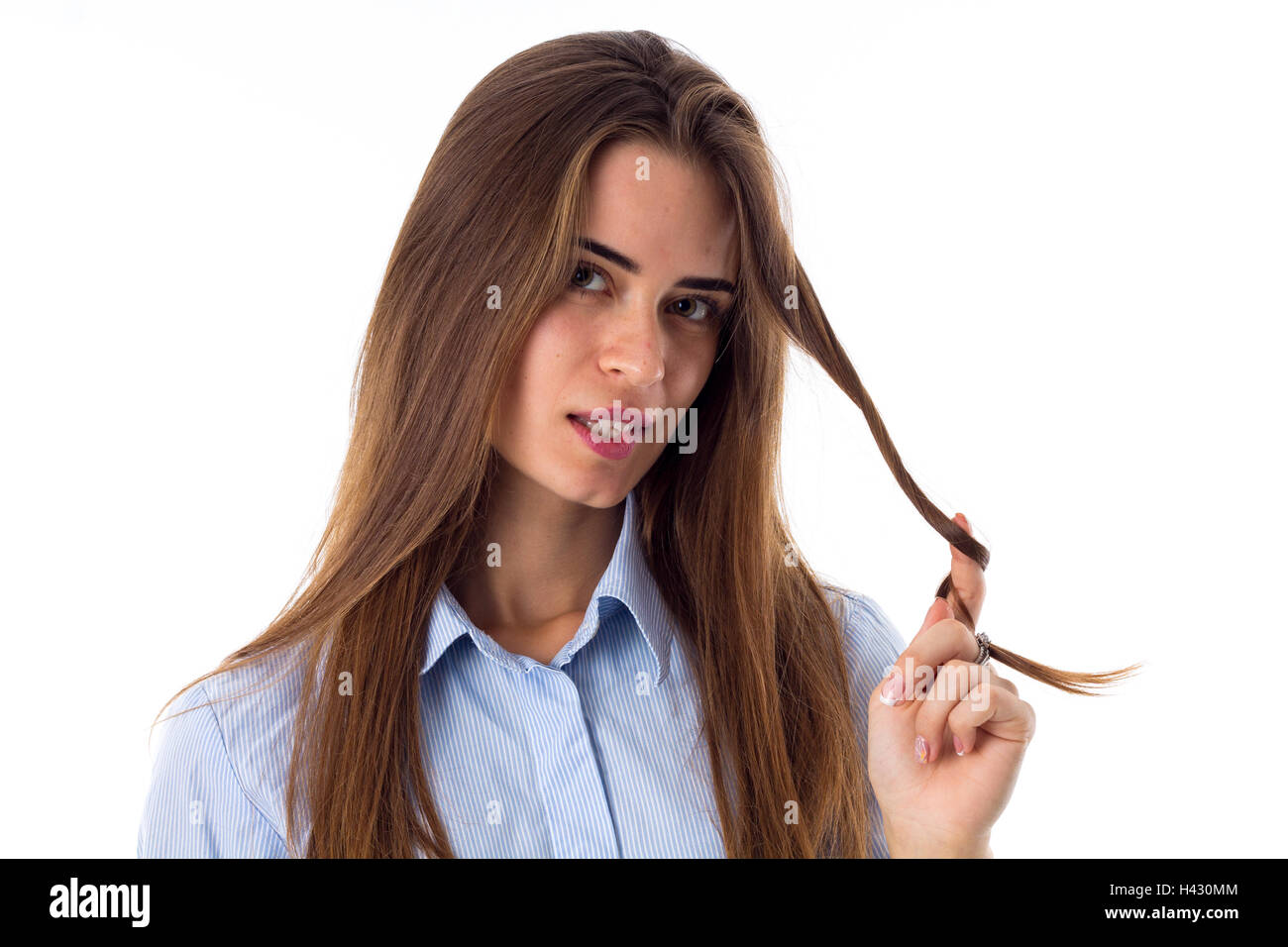 Woman curving her hair Stock Photo - Alamy