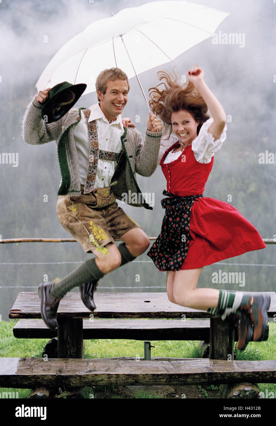 couple, young, traditional costume, dirndl, leather trousers, outside ...