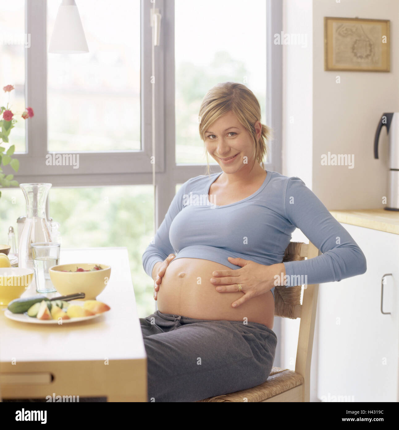 Dining table, woman, pregnant, sit, stroke abdomen, detail, Gestation ...