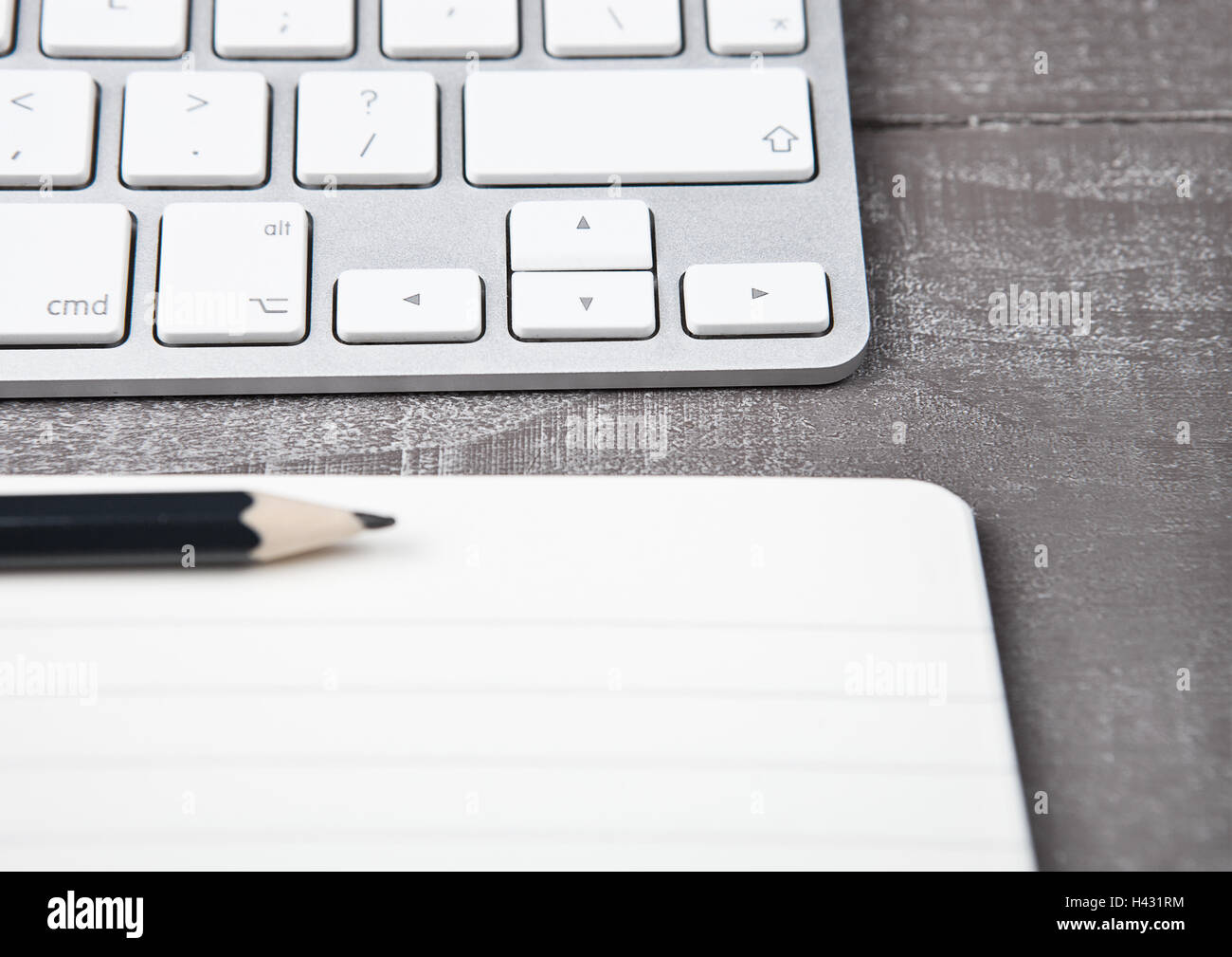 Keyboard with pencil on open notebook sheet on office desk Stock Photo ...