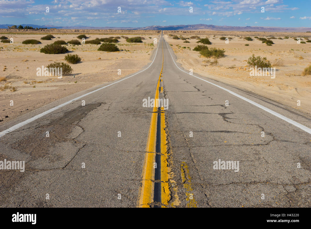 Empty desert wilderness road leads into the southern stretch of Mojave ...