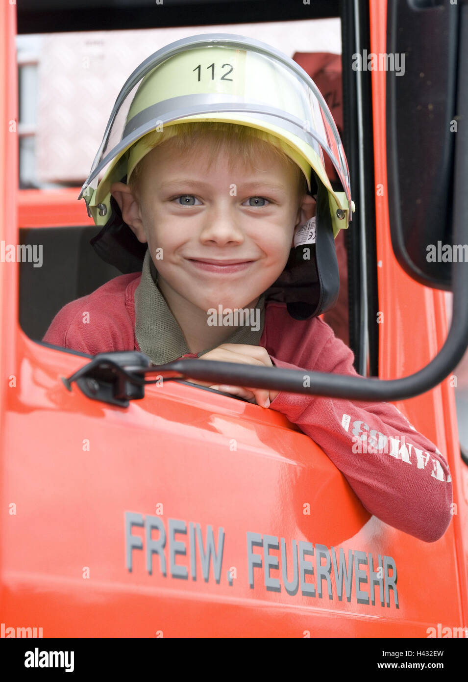 Boy, smile, fire helmet, fire engine, sit, portrait, person, child ...