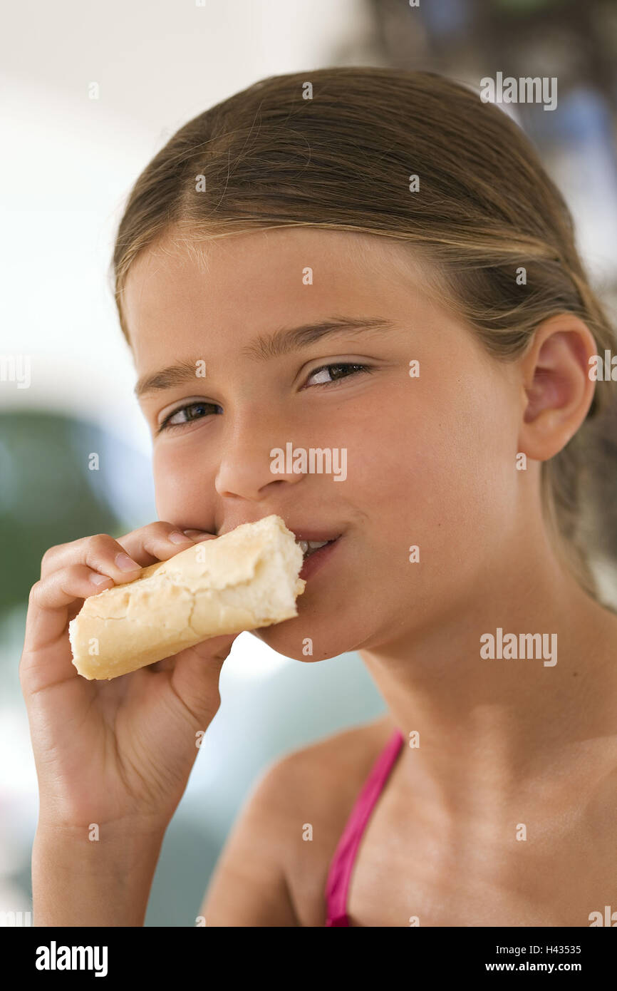 Girls, white bread, eat, view camera Stock Photo - Alamy