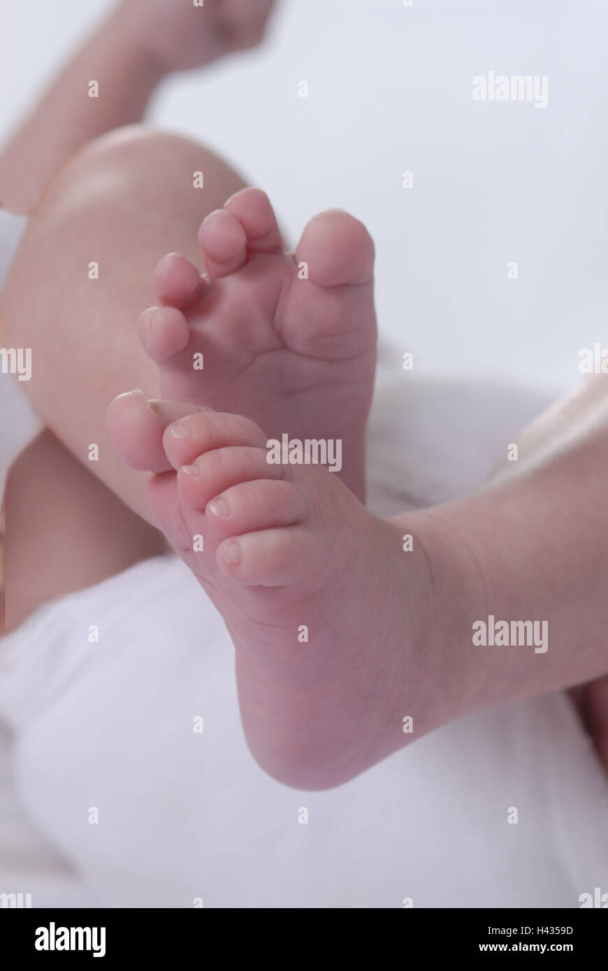 Baby's feet, close-up Stock Photo - Alamy