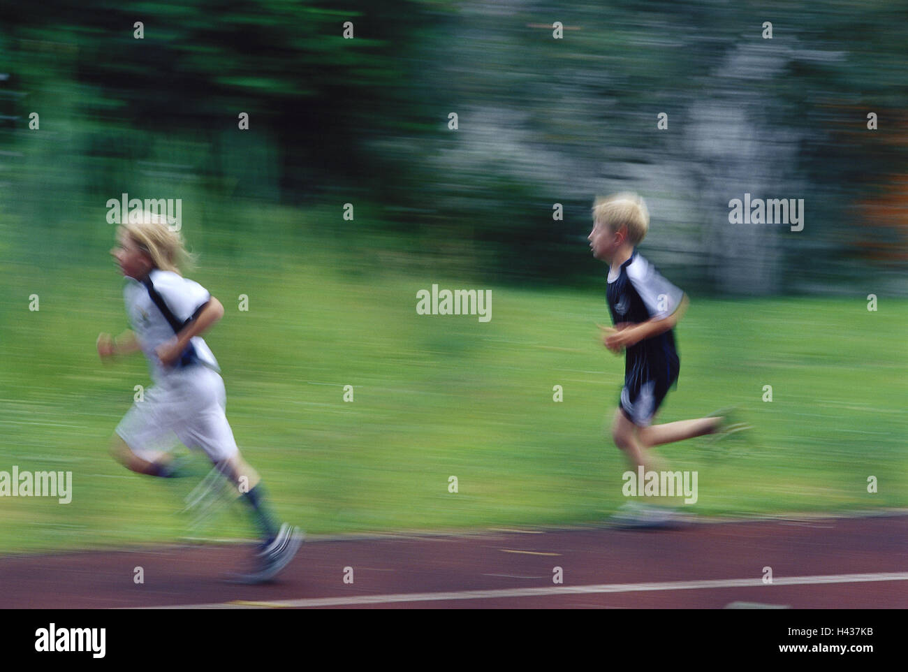 Sports field, boy, run, side view, blur, no model release, person ...