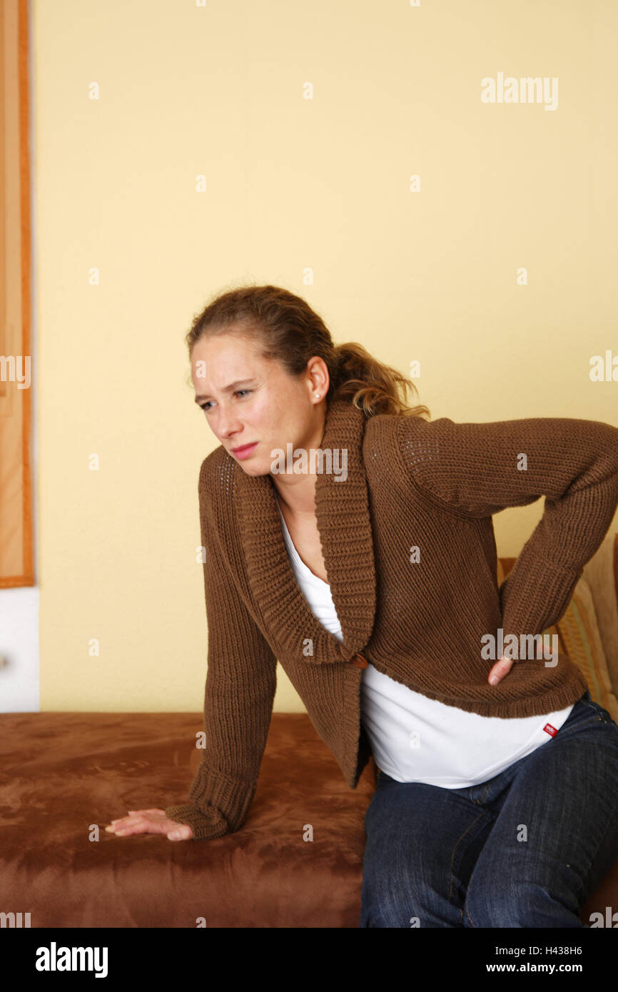 Sitting rooms, woman, young, sofa, sit, gesture, back pains, people ...