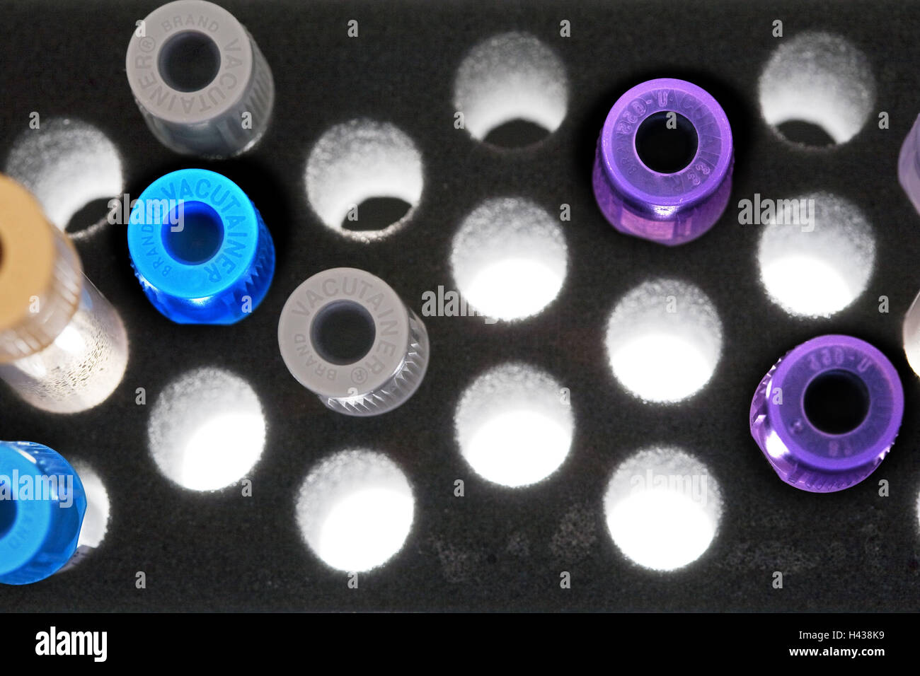 Blood tests, tubes, foamed material, holes, from above, detail Stock ...