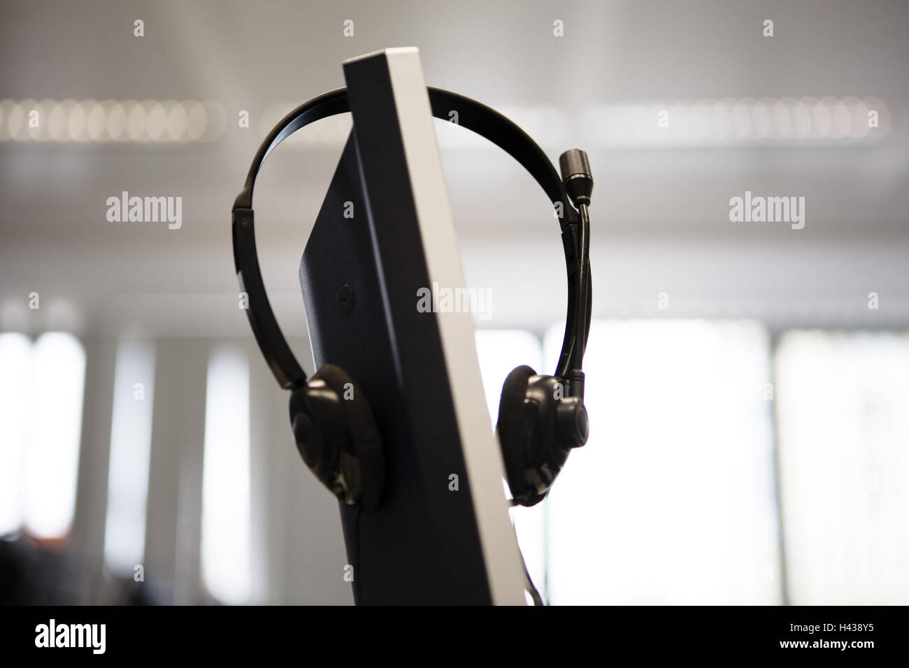 Flat screen, earphone, detail, blur Stock Photo - Alamy