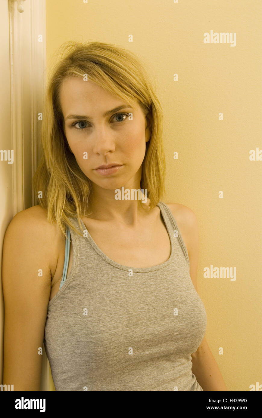Woman, young, stand, wall lean, half portrait, model released Stock ...