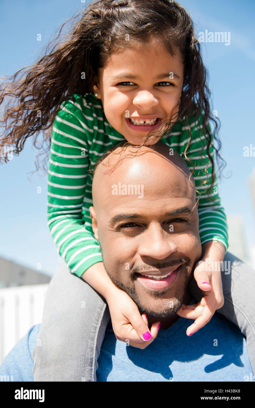 Father carrying daughter on shoulders Stock Photo - Alamy