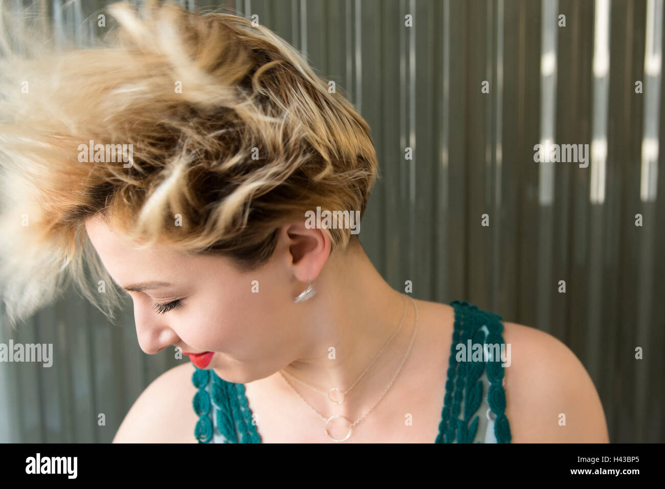 Caucasian woman tossing hair Stock Photo - Alamy