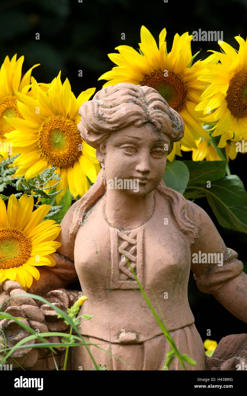 Garden figure with sunflowers Stock Photo - Alamy