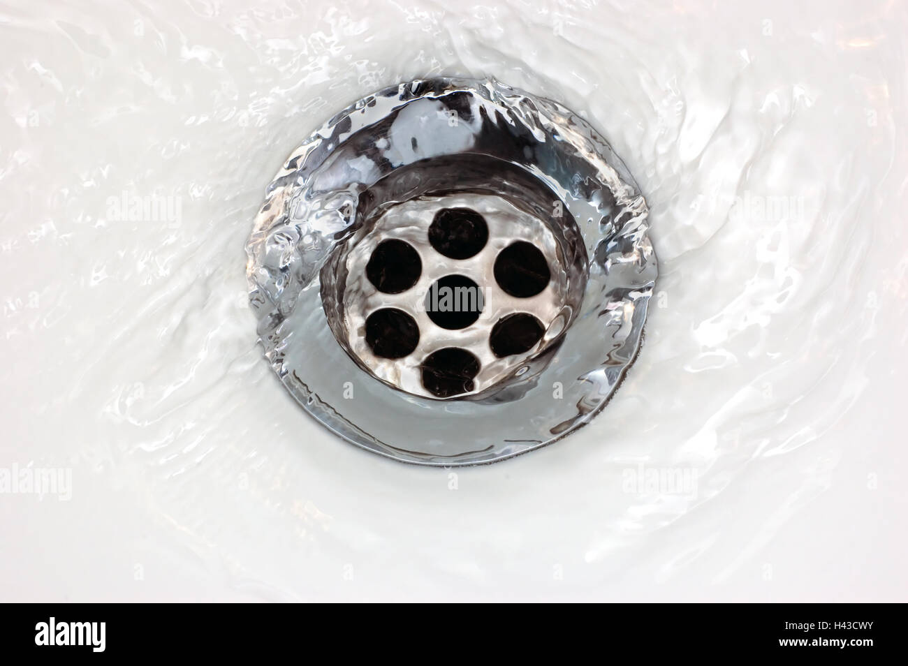 Water running down kitchen sink drain hi-res stock photography and ...