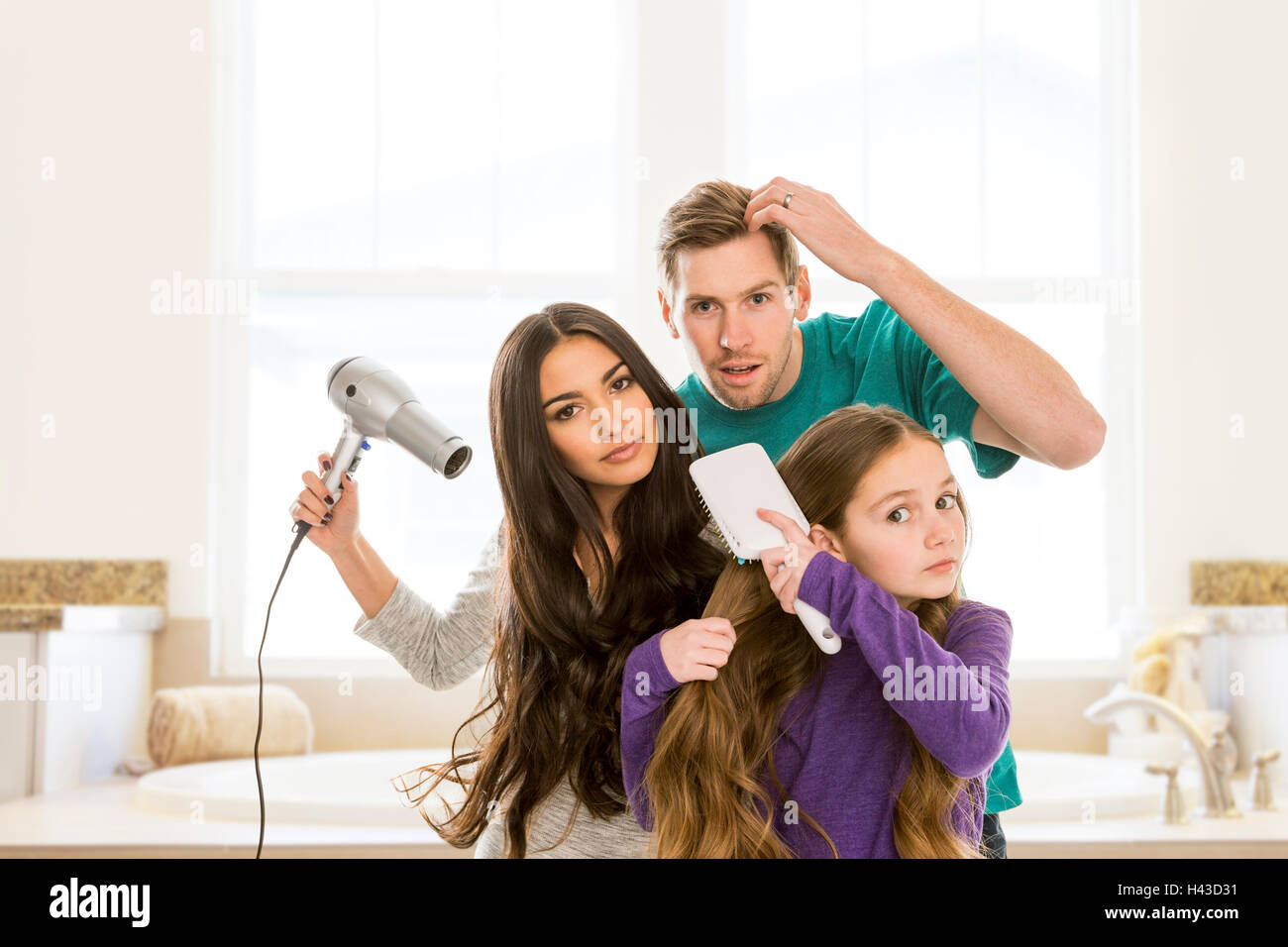 Family grooming hair in bathroom Stock Photo - Alamy